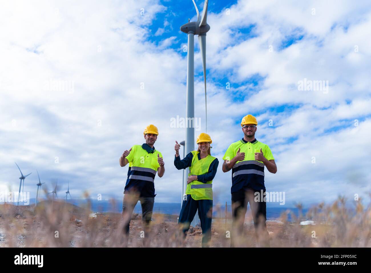 Happy engineers for their job. Skilled workers gives me a thumbs-up ...