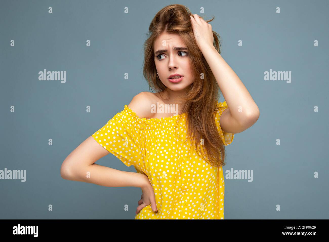 Young sad upset beautiful dark blonde woman with sincere emotions ...