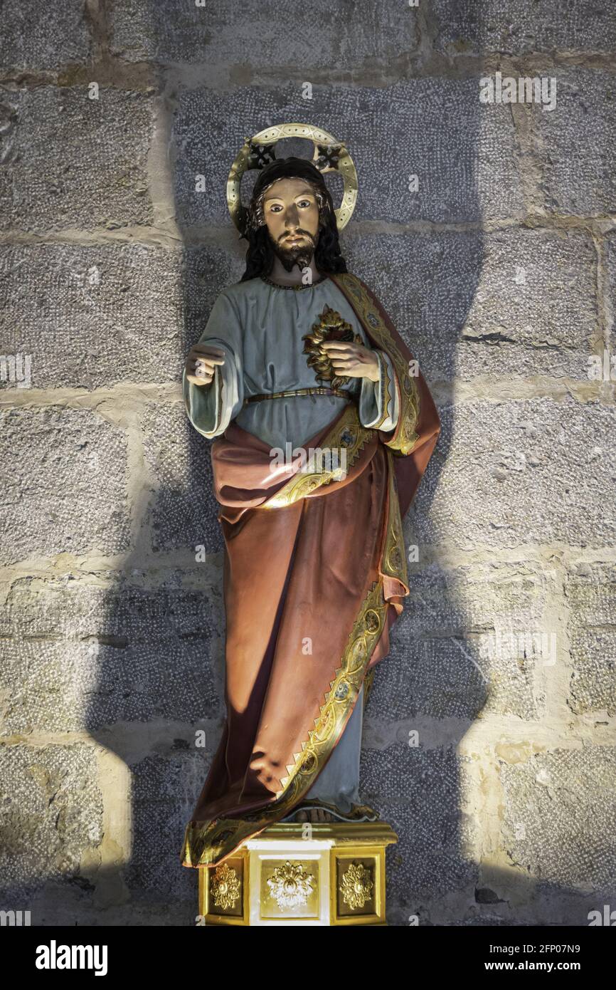 Vertical shot of Jesus Christ statue against the wall Stock Photo - Alamy