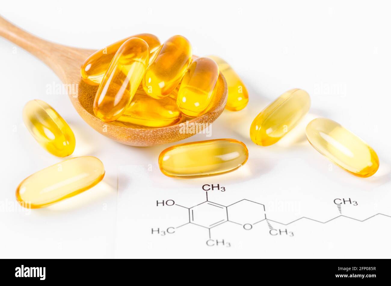 Fish oil capsules and chemical formula on white background Stock Photo ...