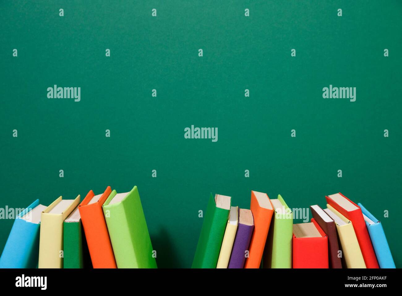 Composition with vintage old hardback books, colored background. Books ...