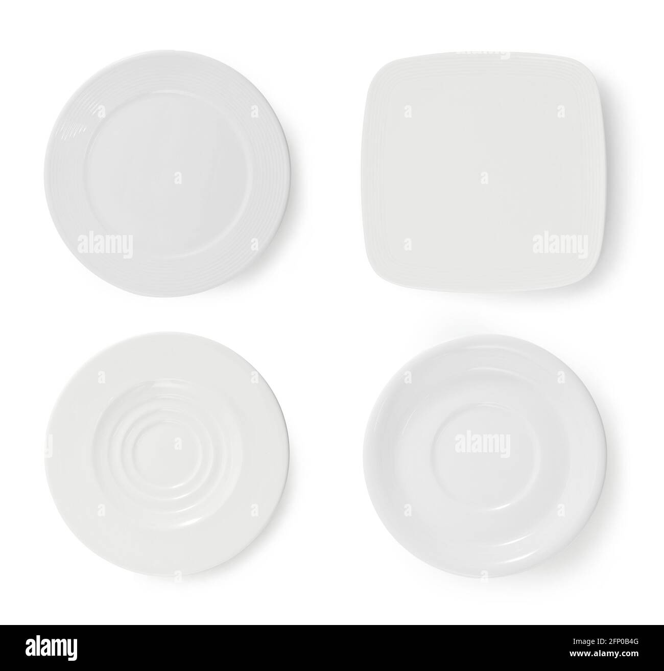 set of white plate on white background Stock Photo - Alamy