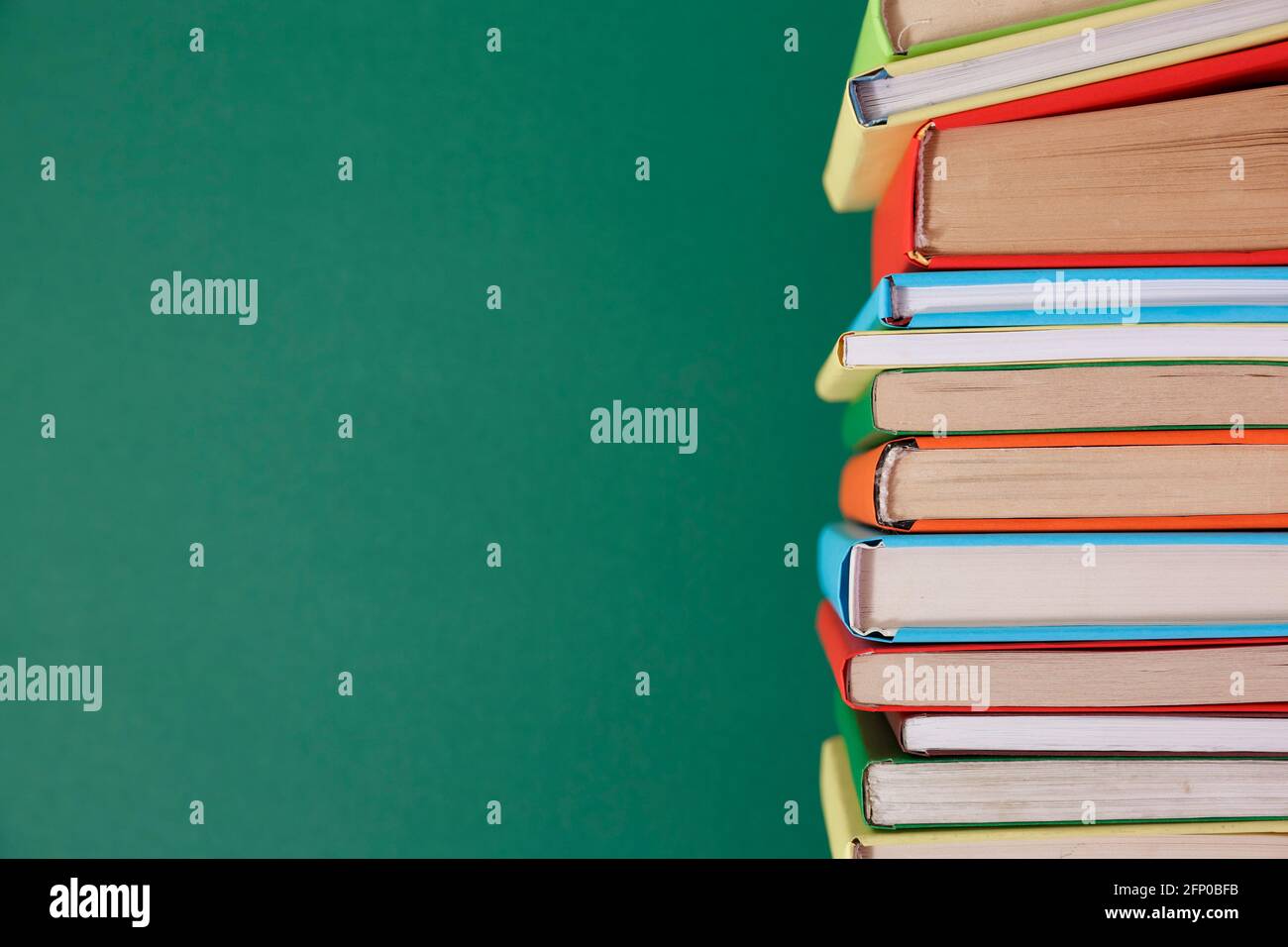 Composition with vintage old hardback books, colored background. Books ...