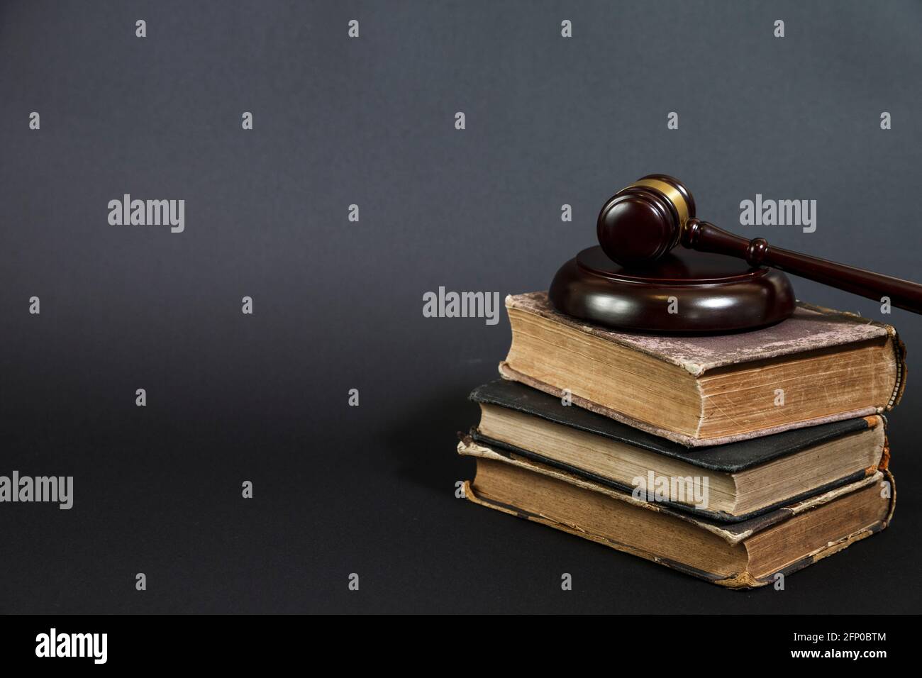 Law concept - law book with a wooden judges gavel on table in a ...