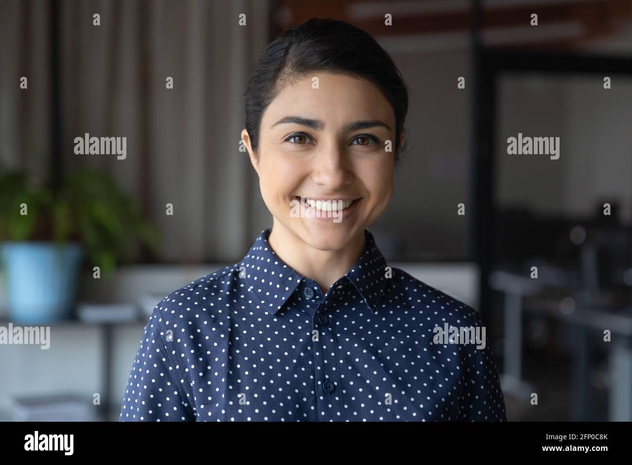 Headshot portrait of smiling Indian female employee Stock Photo - Alamy