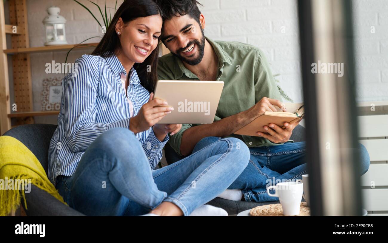 Young Happy Multiracial Couple In Love Resting Having Fun At Home
