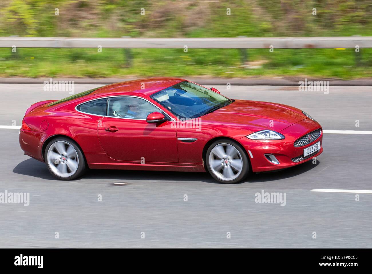 2014 red Jaguar Signature Xk; Vehicular traffic, moving vehicles, cars ...