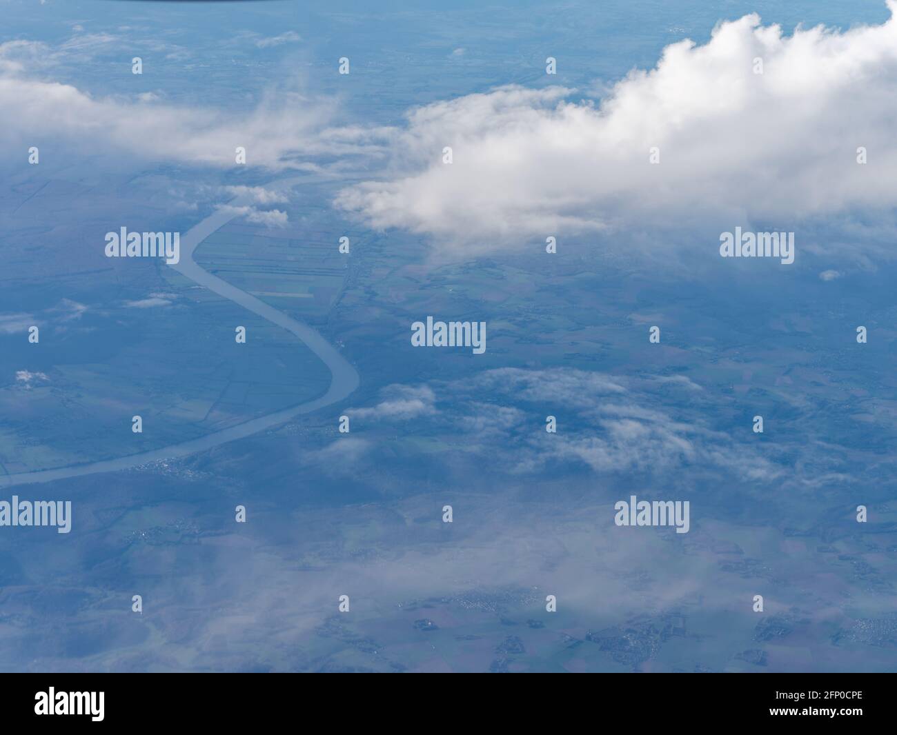 Aerial view of agricultural fields with a s-shaped river in France ...