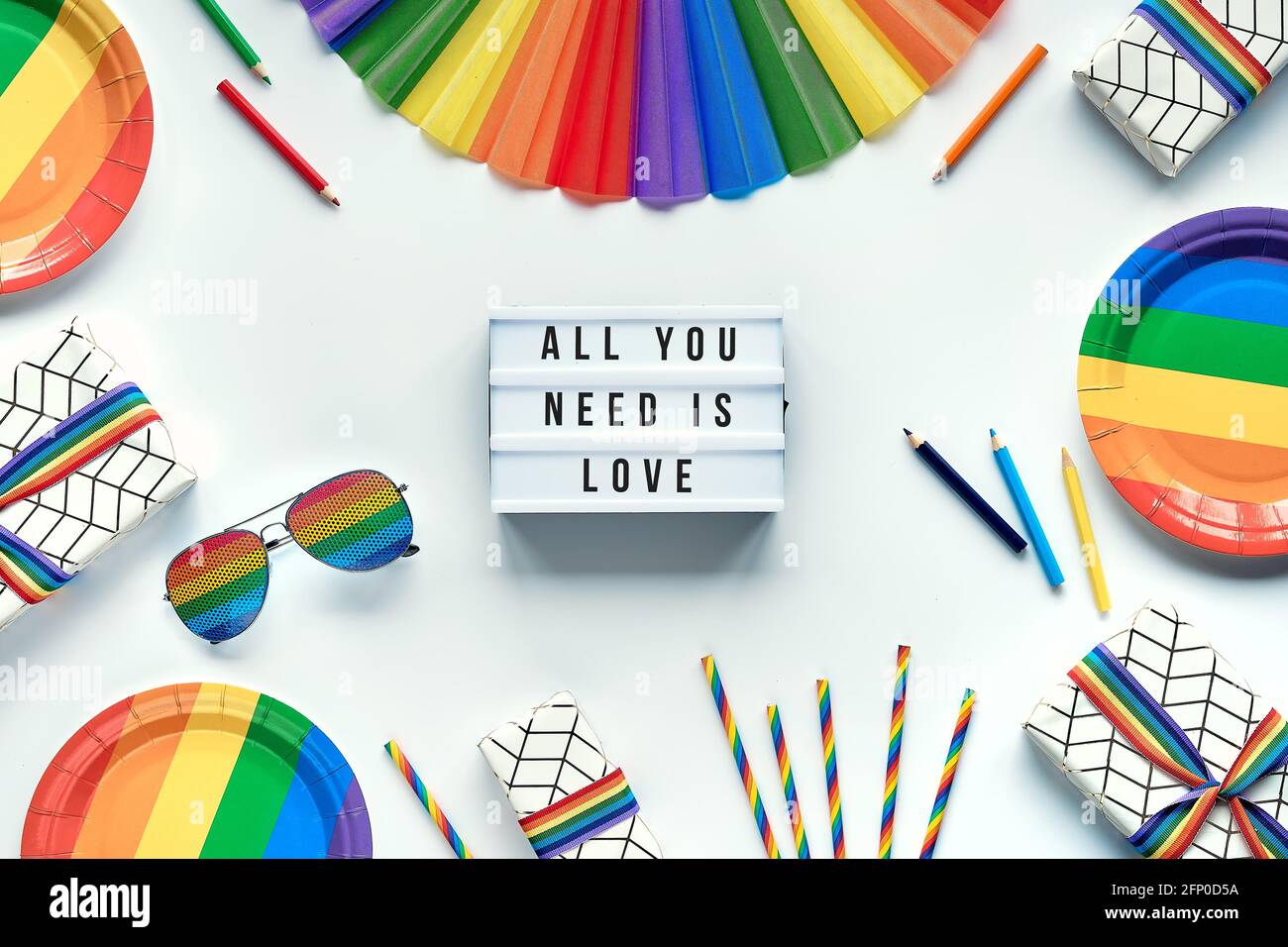LGBTQ pride month decor. Text All You Need Is Love on lightbox. Rainbow ...