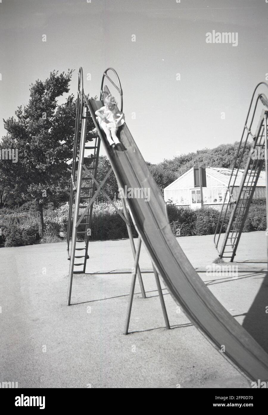 1960, historical, outside, an infant child, a little girl on top of on ...