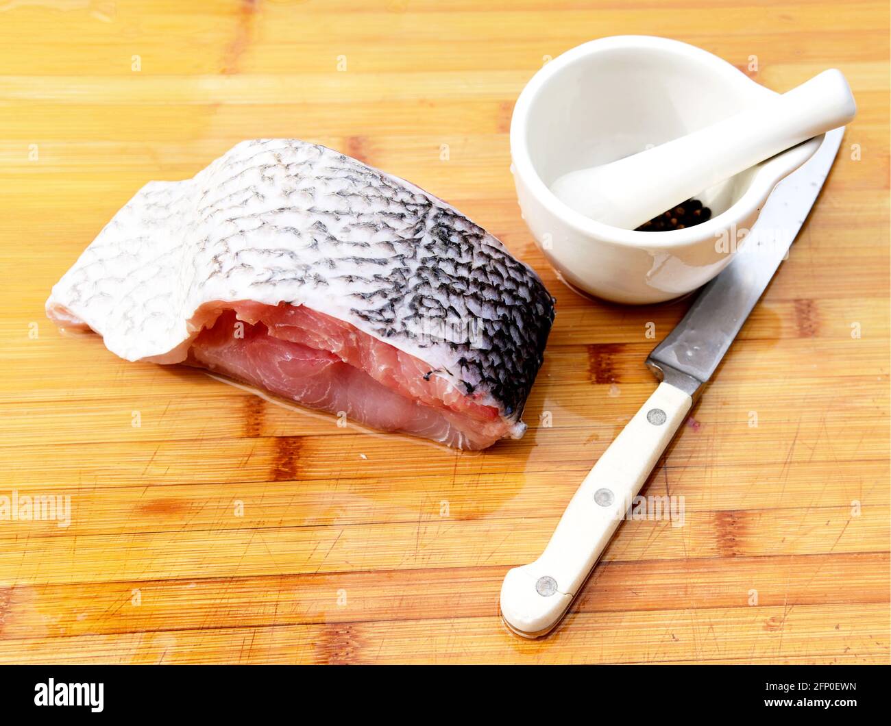 a piece of grouper fish cleaned and ready to be seasoned and cooked ...