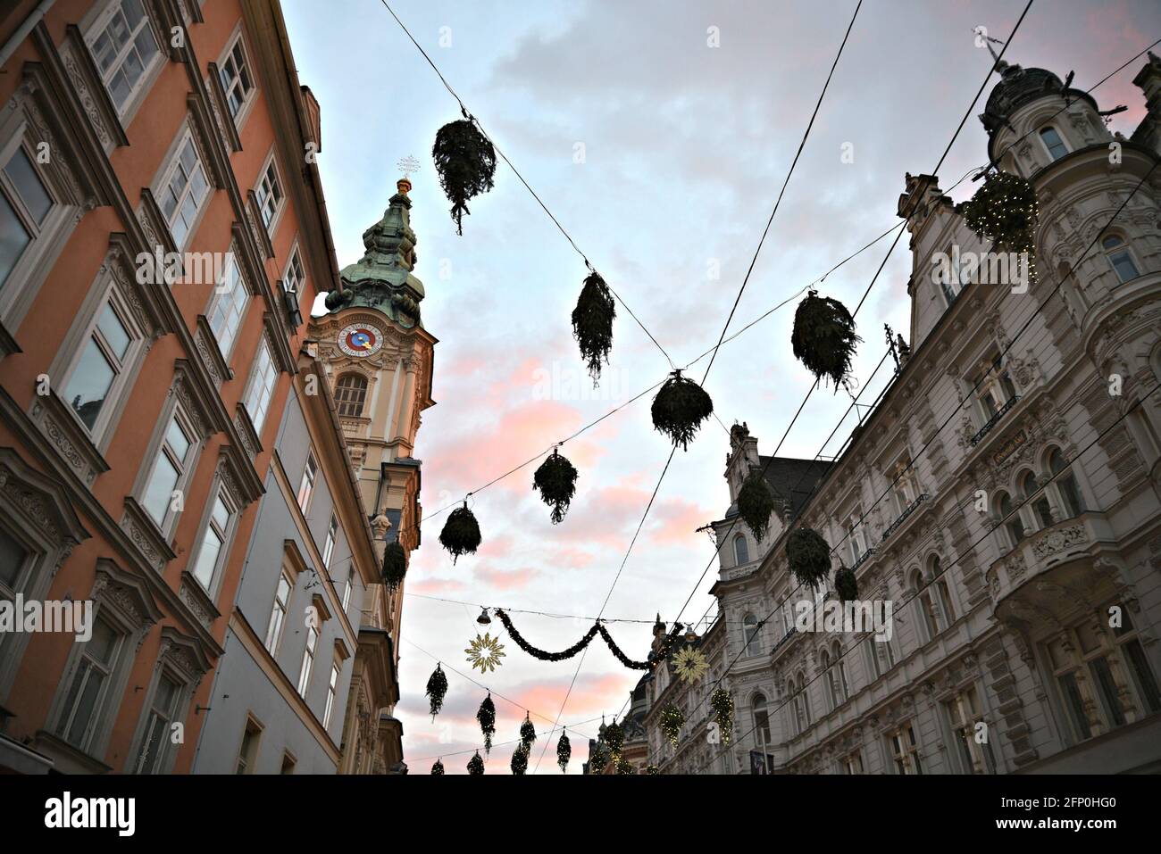 Sunset cityscape with Baroque style buildings and Christmas decorations ...