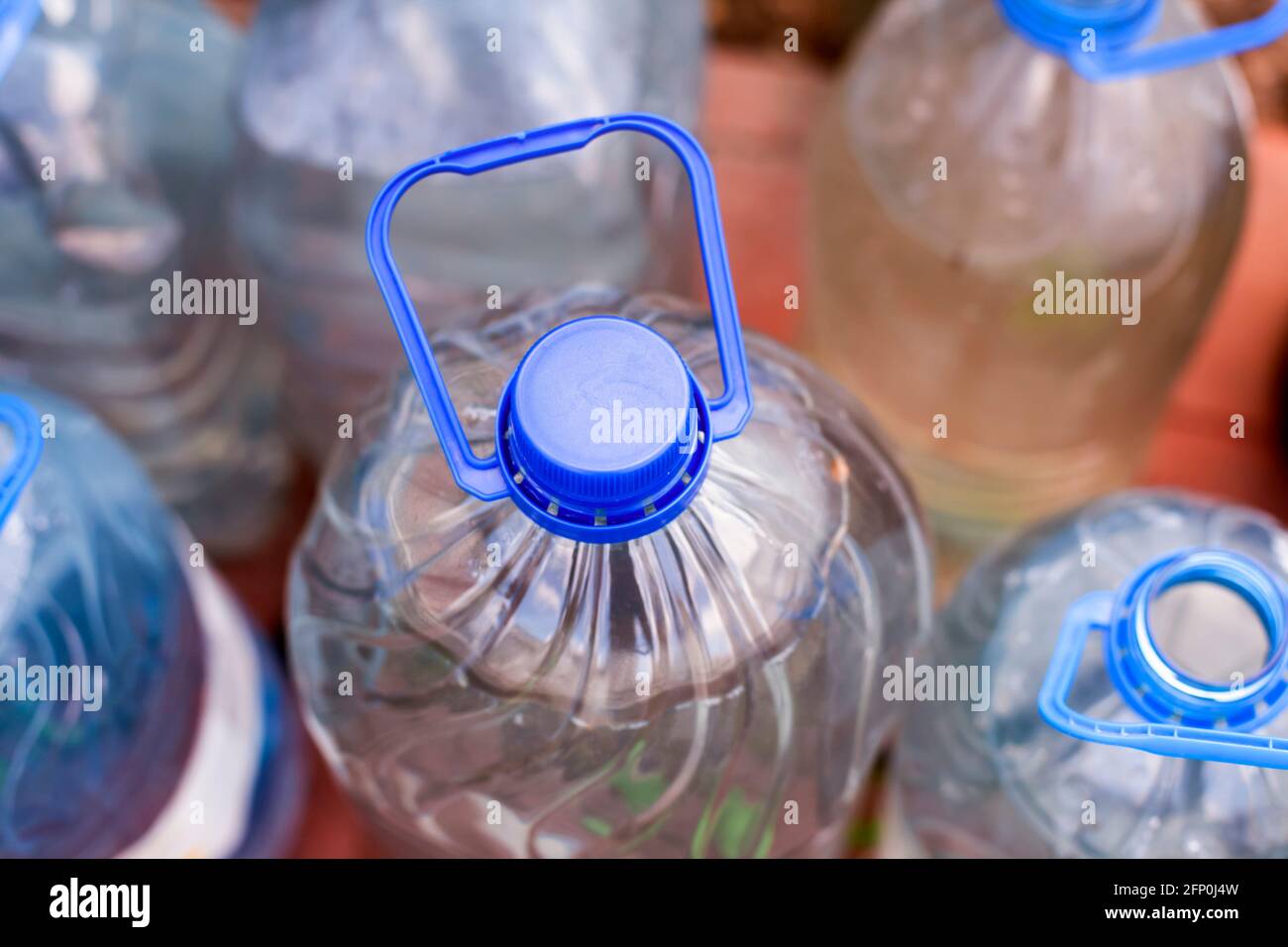 Some plastic bottles with water. Top view Stock Photo - Alamy