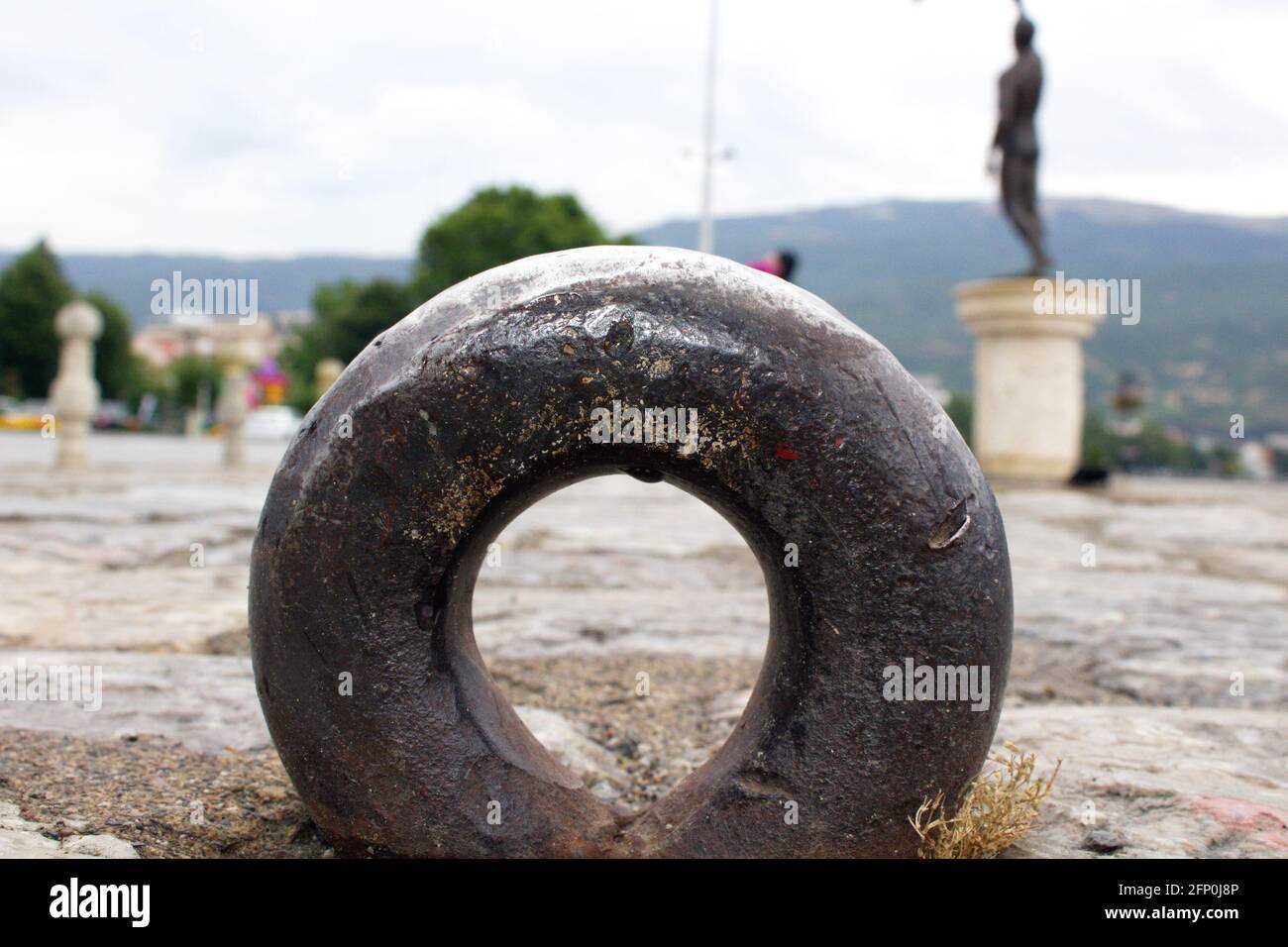 Round ring boat bollard at a beach Stock Photo - Alamy
