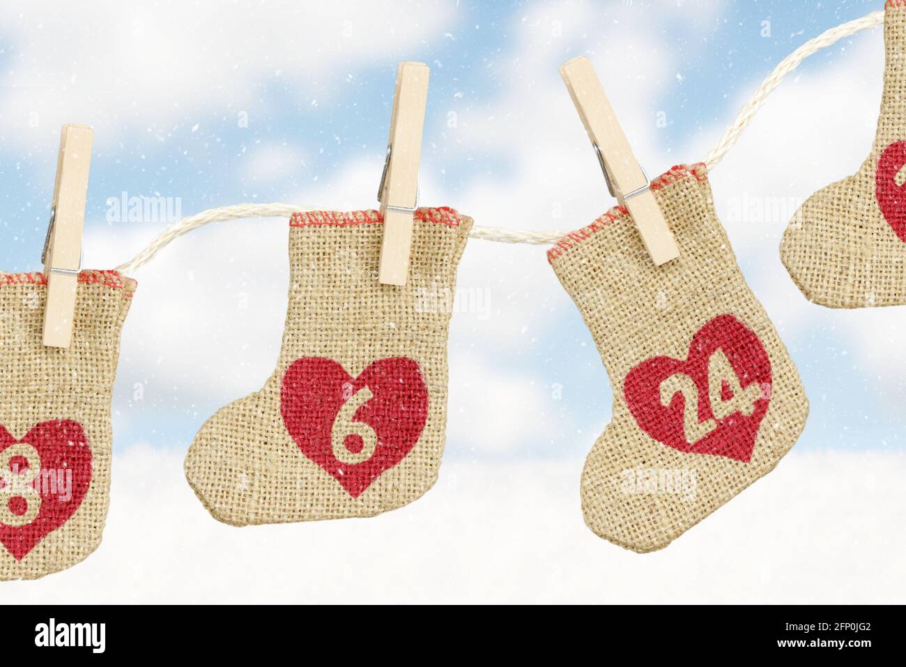 christmas calendar hangs on rope in snow landscape Stock Photo - Alamy