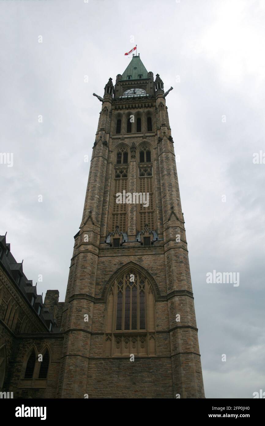 Vertical low angle shot of the peace tower on a gloomy day in Ottawa ...