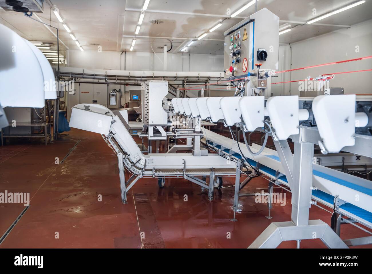 Meat processing machine in a factory. Industrial and technology concept ...