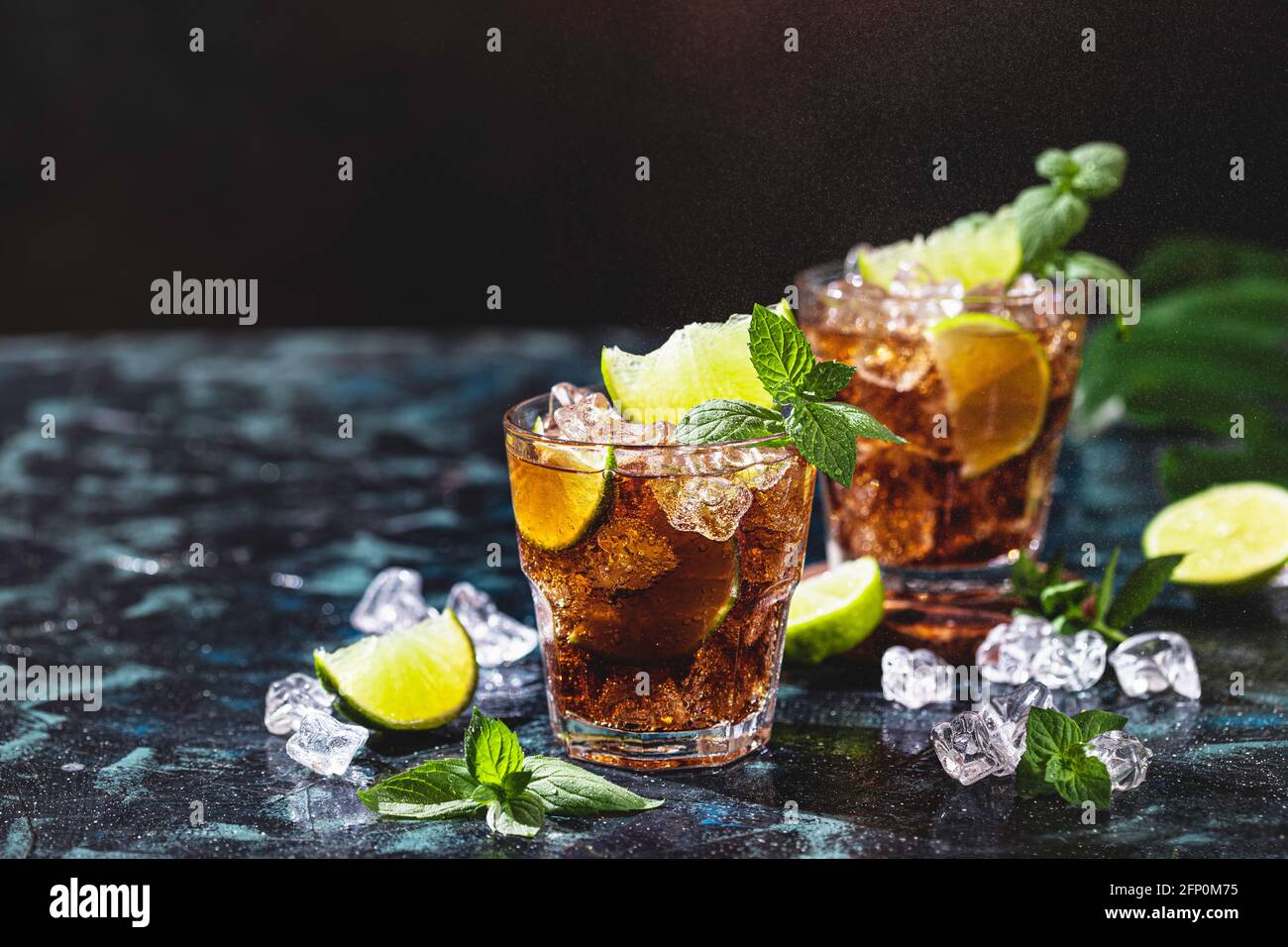 Cuba Libre with brown rum, cola, mint and lime. Cold Longdrink, alcohol ...
