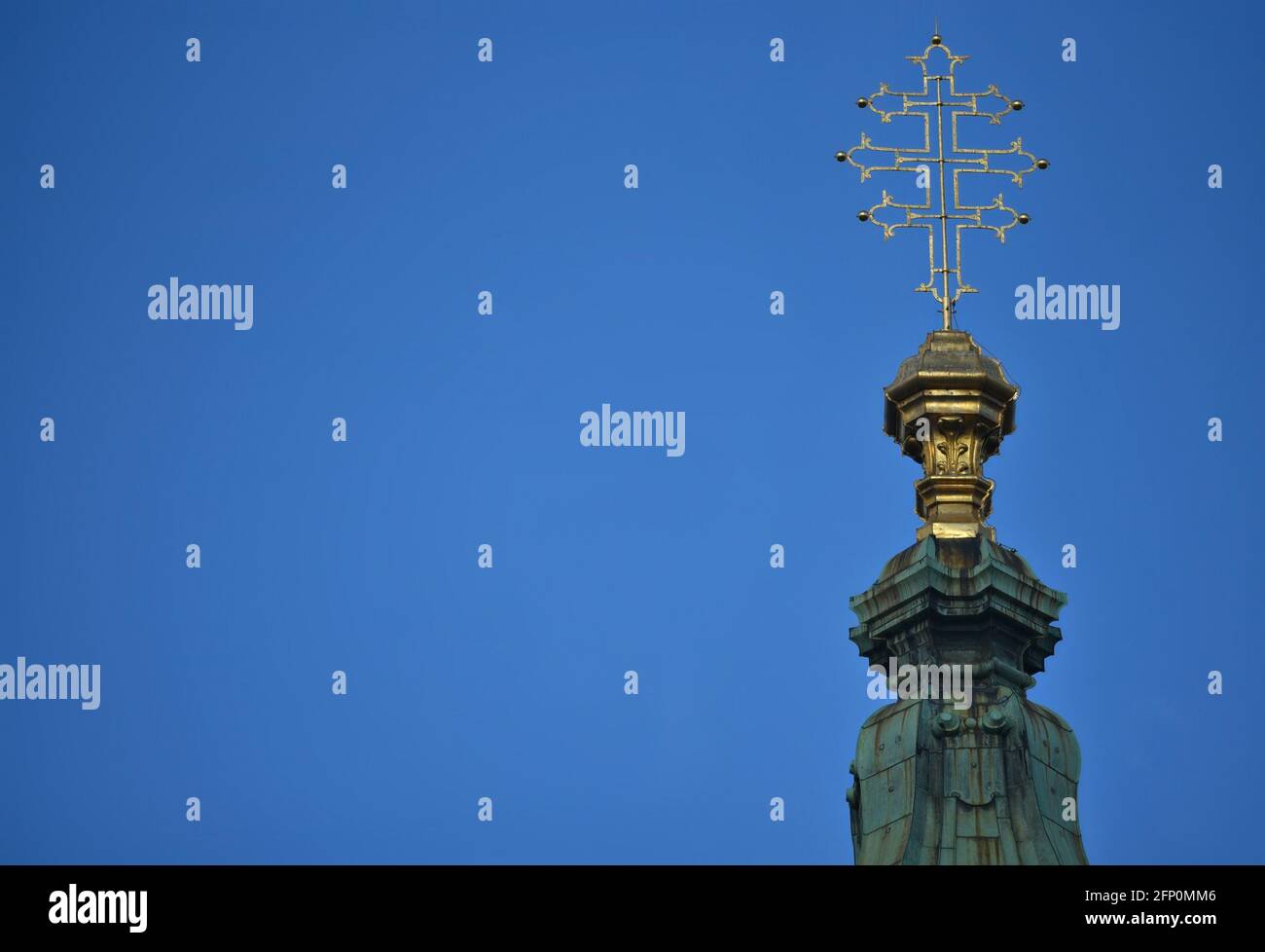 Baroque style bell tower architectural detail with a religious symbol ...