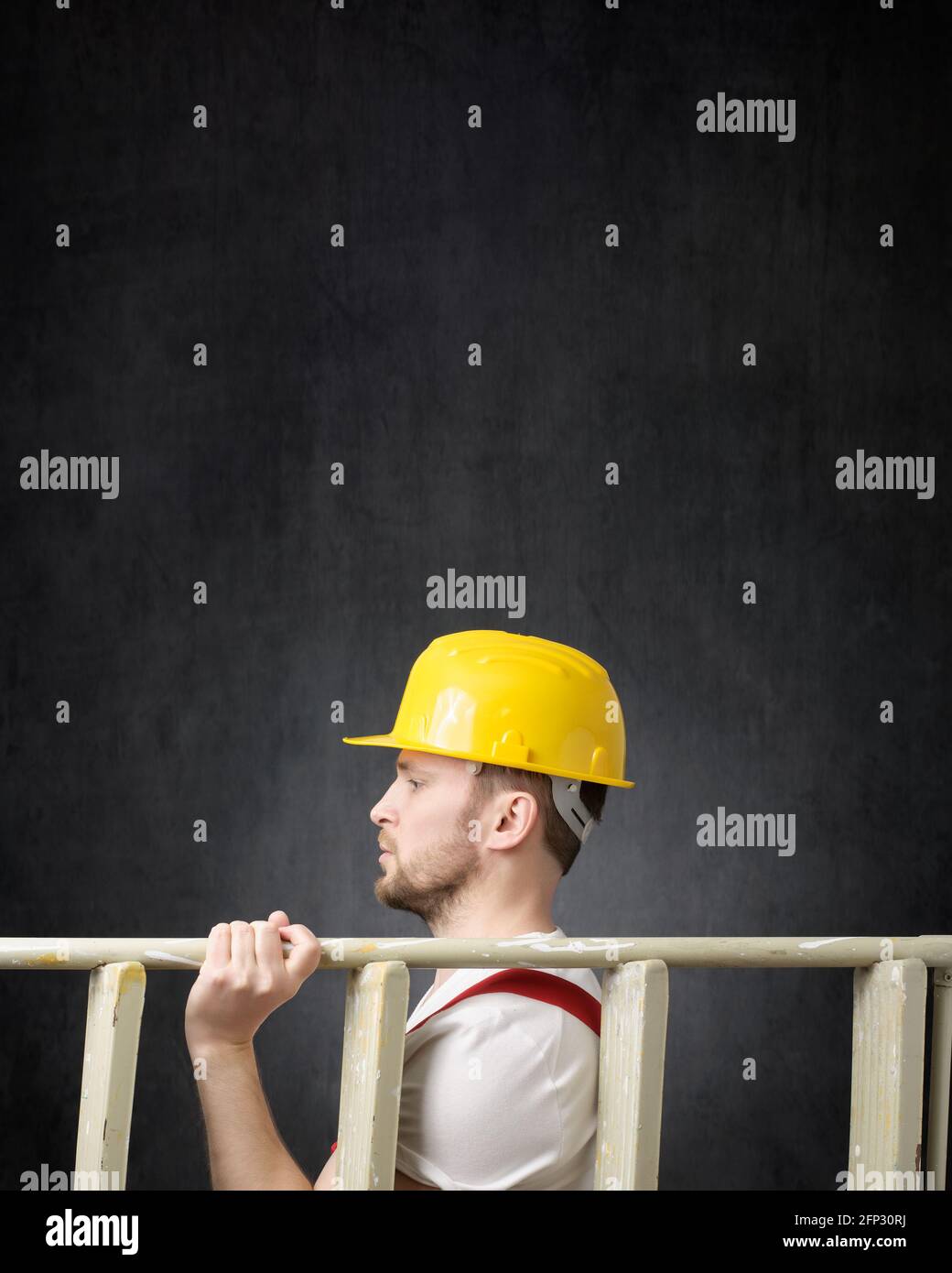 Construction worker holding ladder hi-res stock photography and images ...