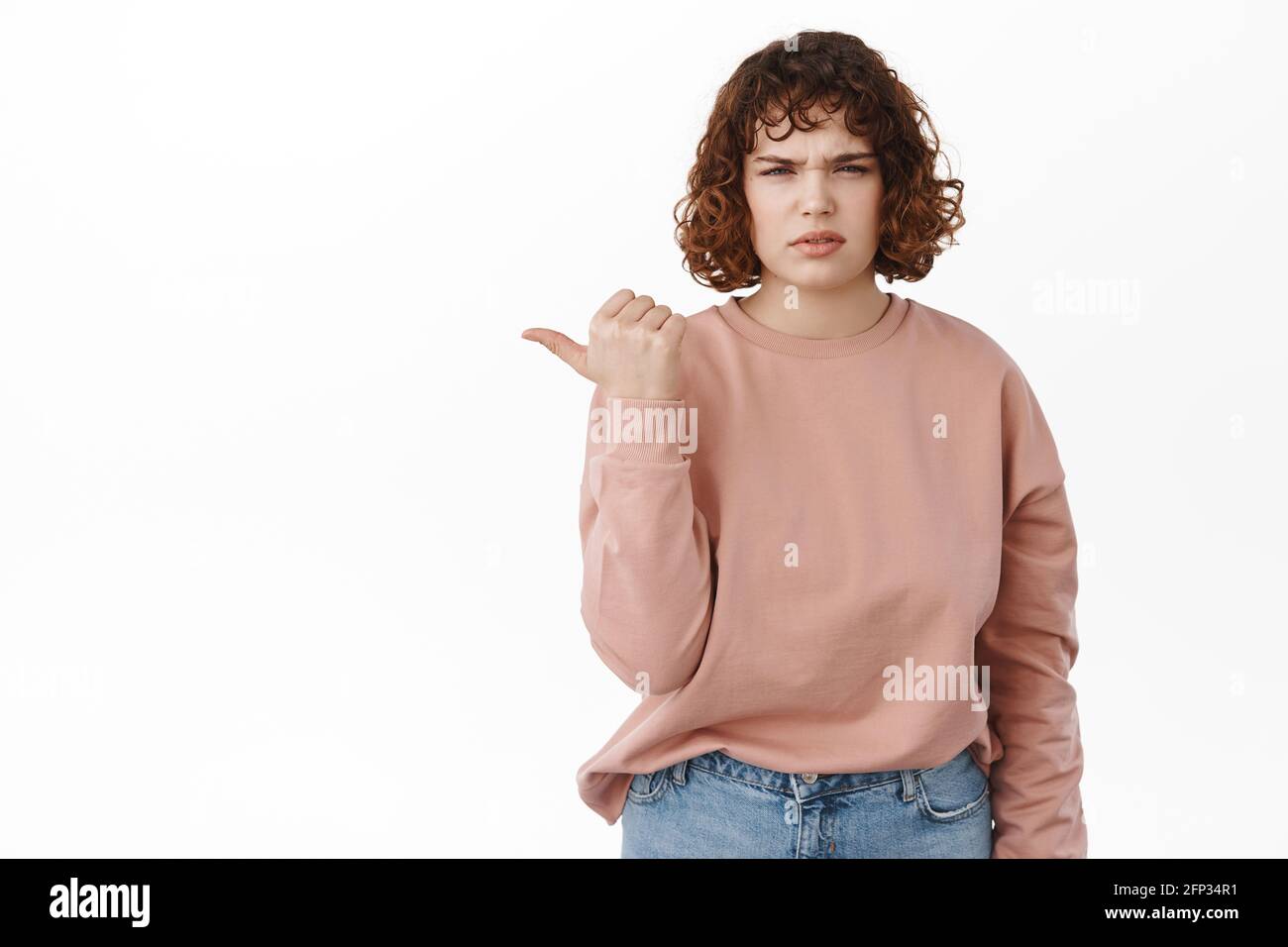 Disappointed girl complains, points left at bad promo offer, displeased ...