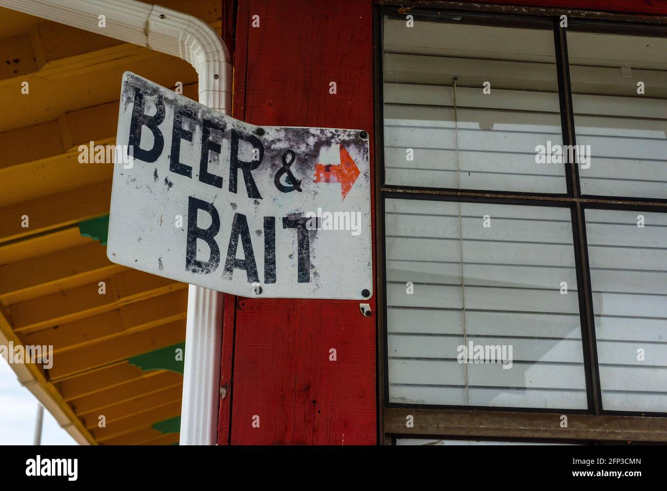 An old sign on the Fairhope Municipal Pier points the way to beer and ...