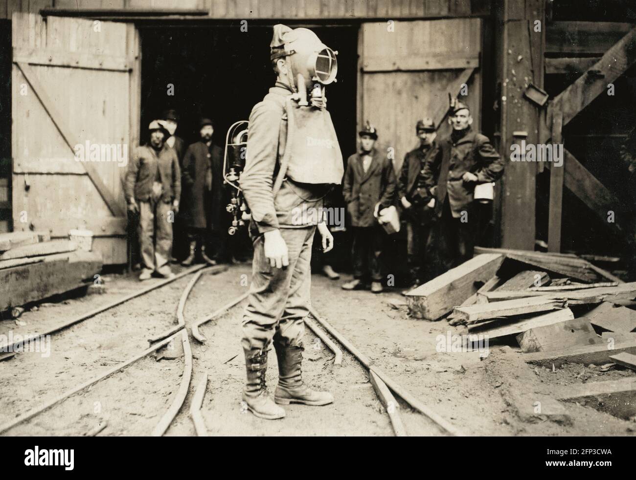 Child Labour: A miner wearing a Draeger Oxygen Helmet for underground ...