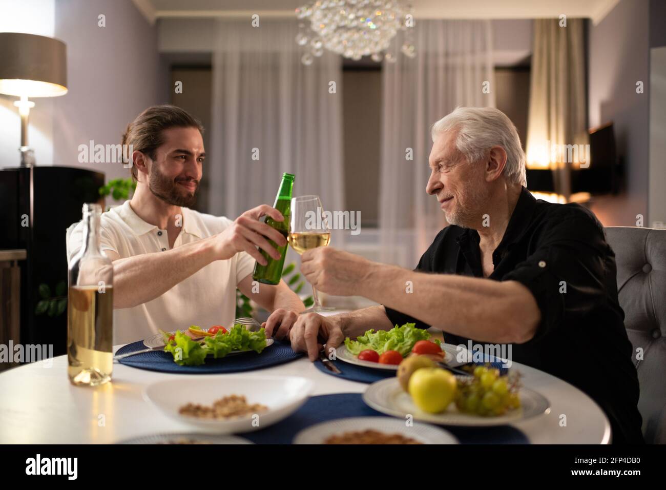 Senior man young man eat hi-res stock photography and images - Alamy