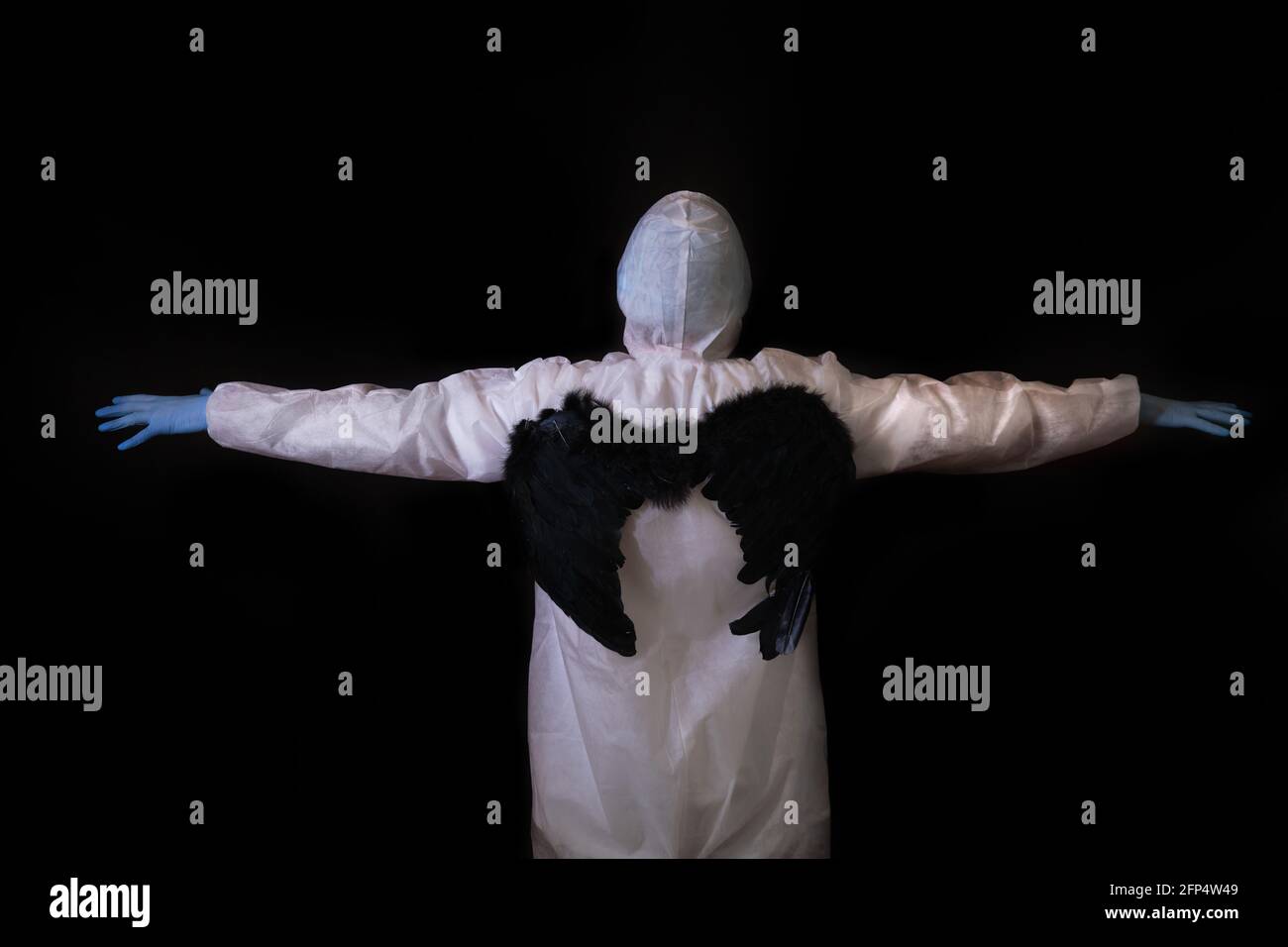 Doctor stands with his back with black wings of a dark angel Stock ...