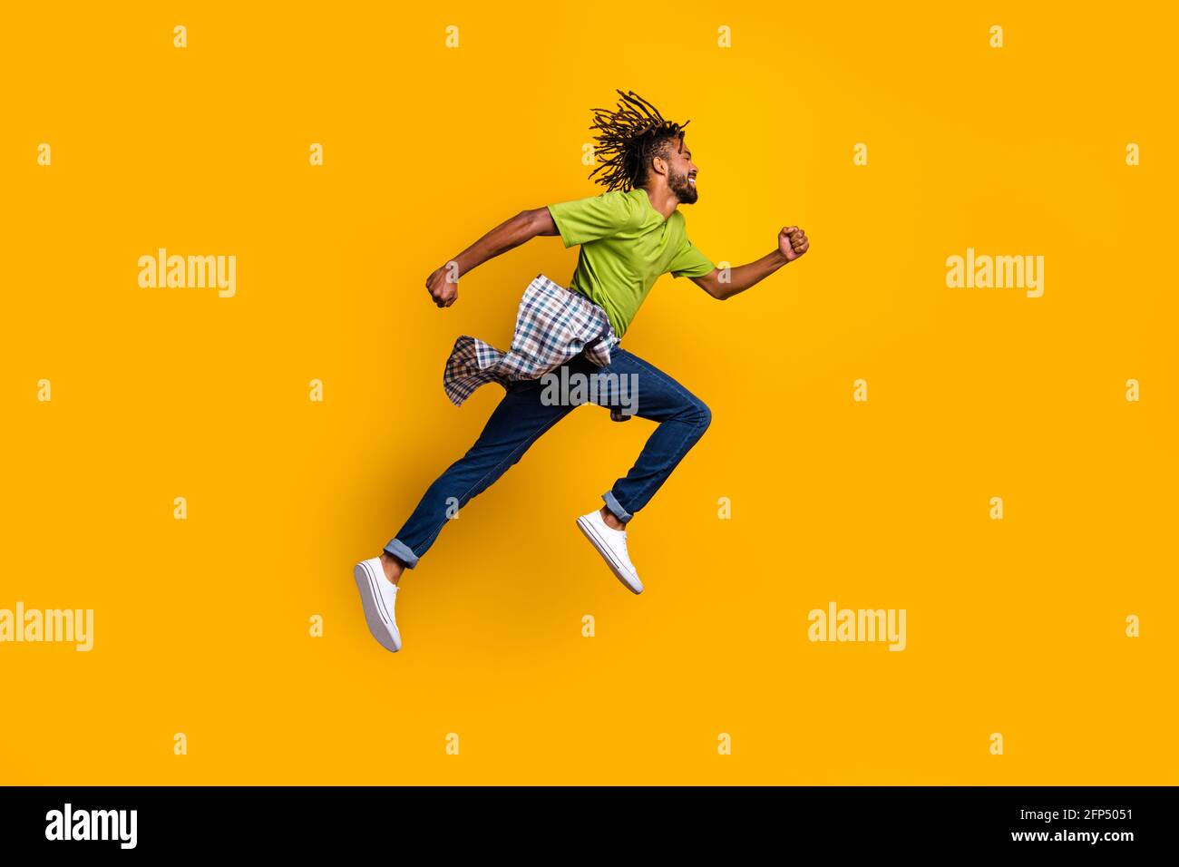 Photo portrait full body side view of man running jumping up isolated ...
