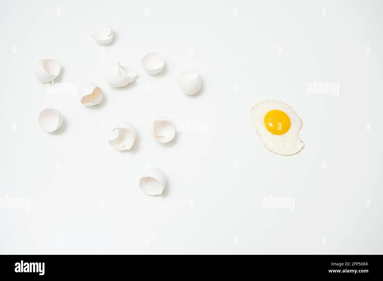 scrambled eggs with whole yolk and broken shells Stock Photo - Alamy