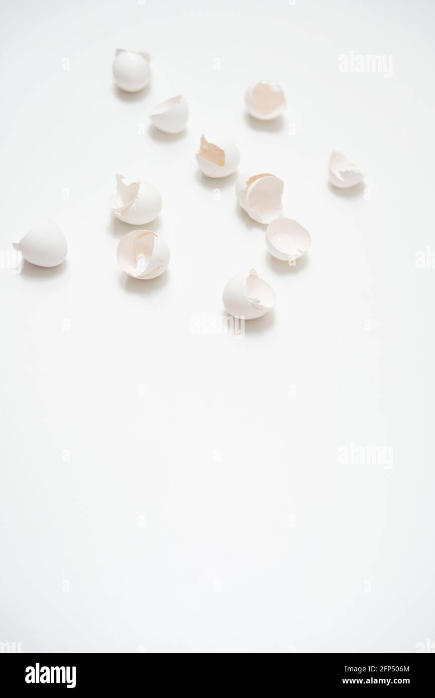 broken shells from eggs on white background Stock Photo - Alamy