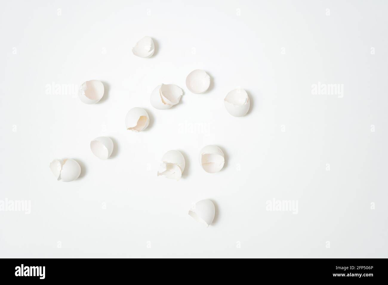 broken shells from eggs on white background Stock Photo - Alamy
