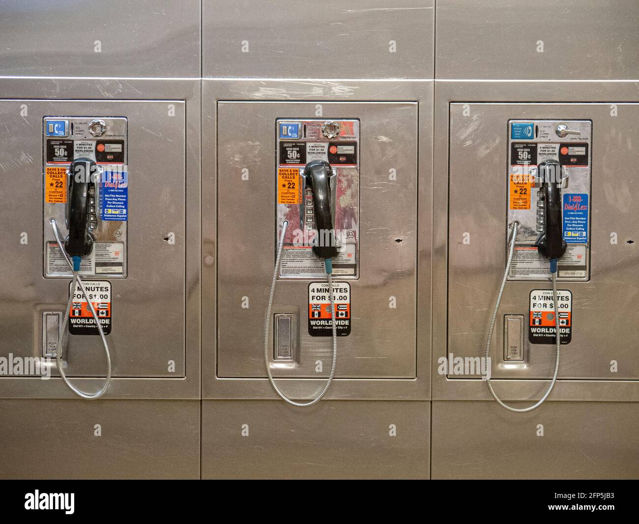 3 payphones hanging side by side on a wall at Grand Central Station ...