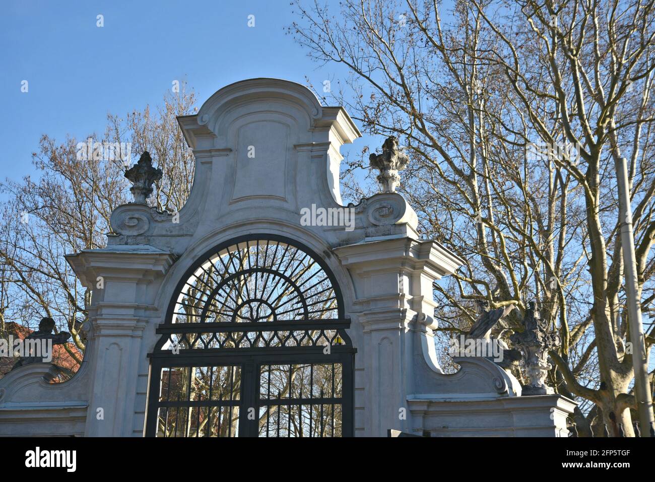 Scenic landscape with entrance gate portal view of Schloss Eggenberg a ...