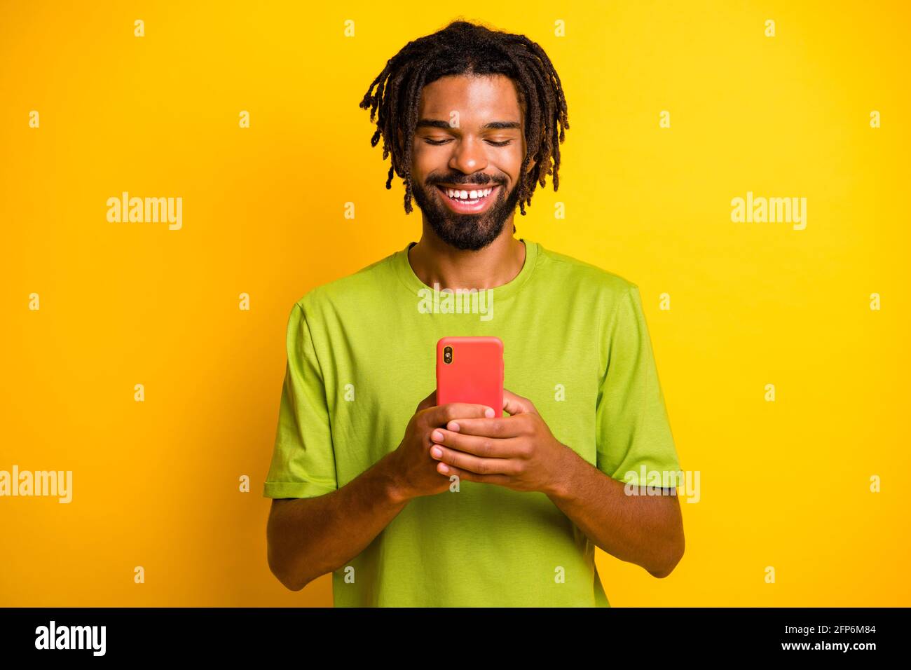 Photo of positive dark skin guy use cellphone read social media news ...