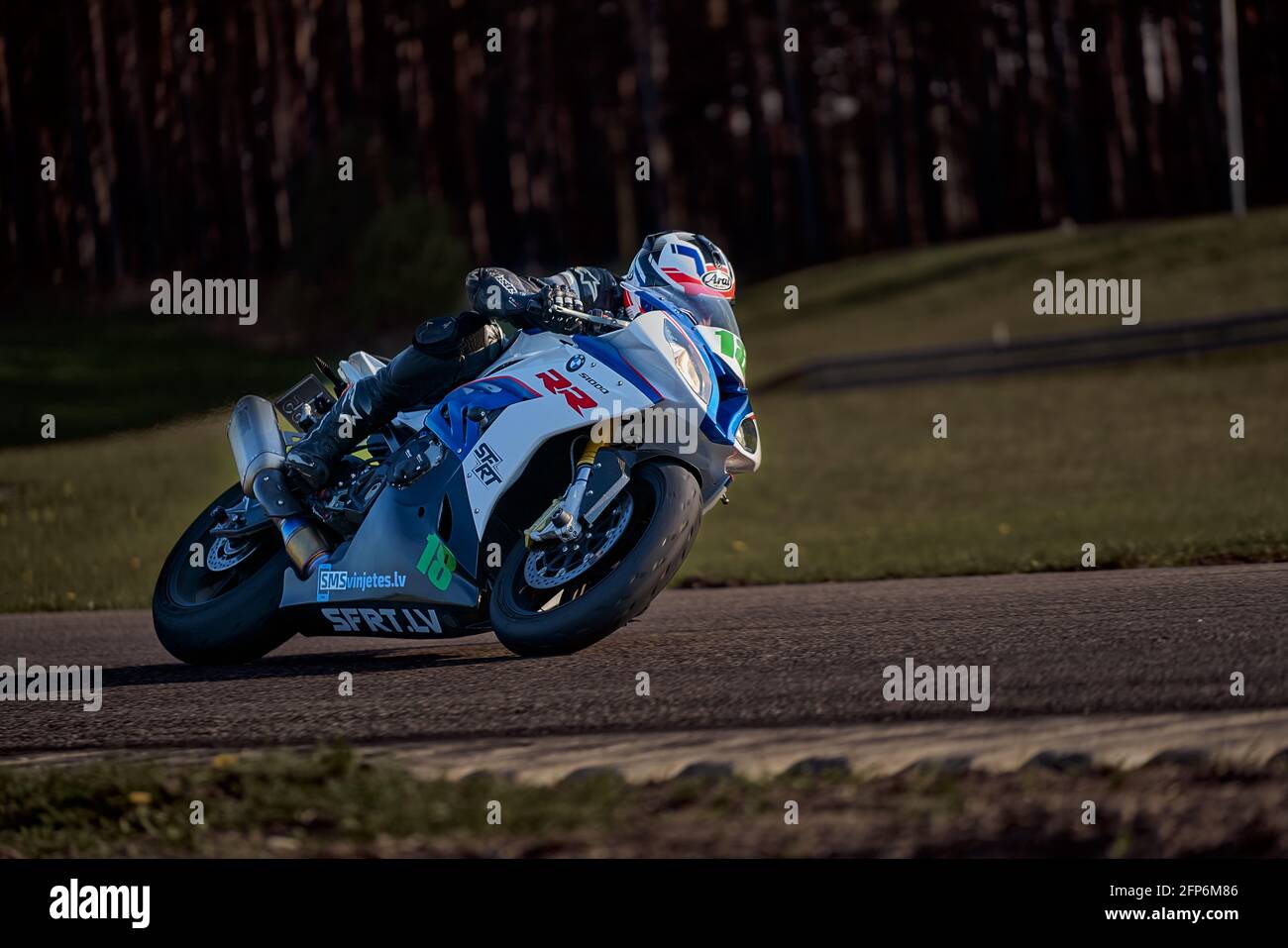 man riding motorcycle in asphalt road Stock Photo - Alamy
