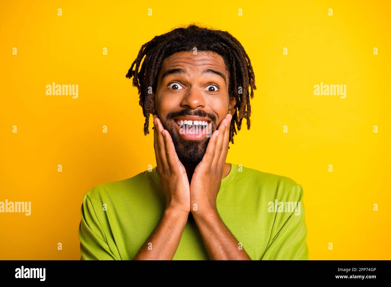 Photo of crazy astonished dark skin guy touch hand face scream isolated ...