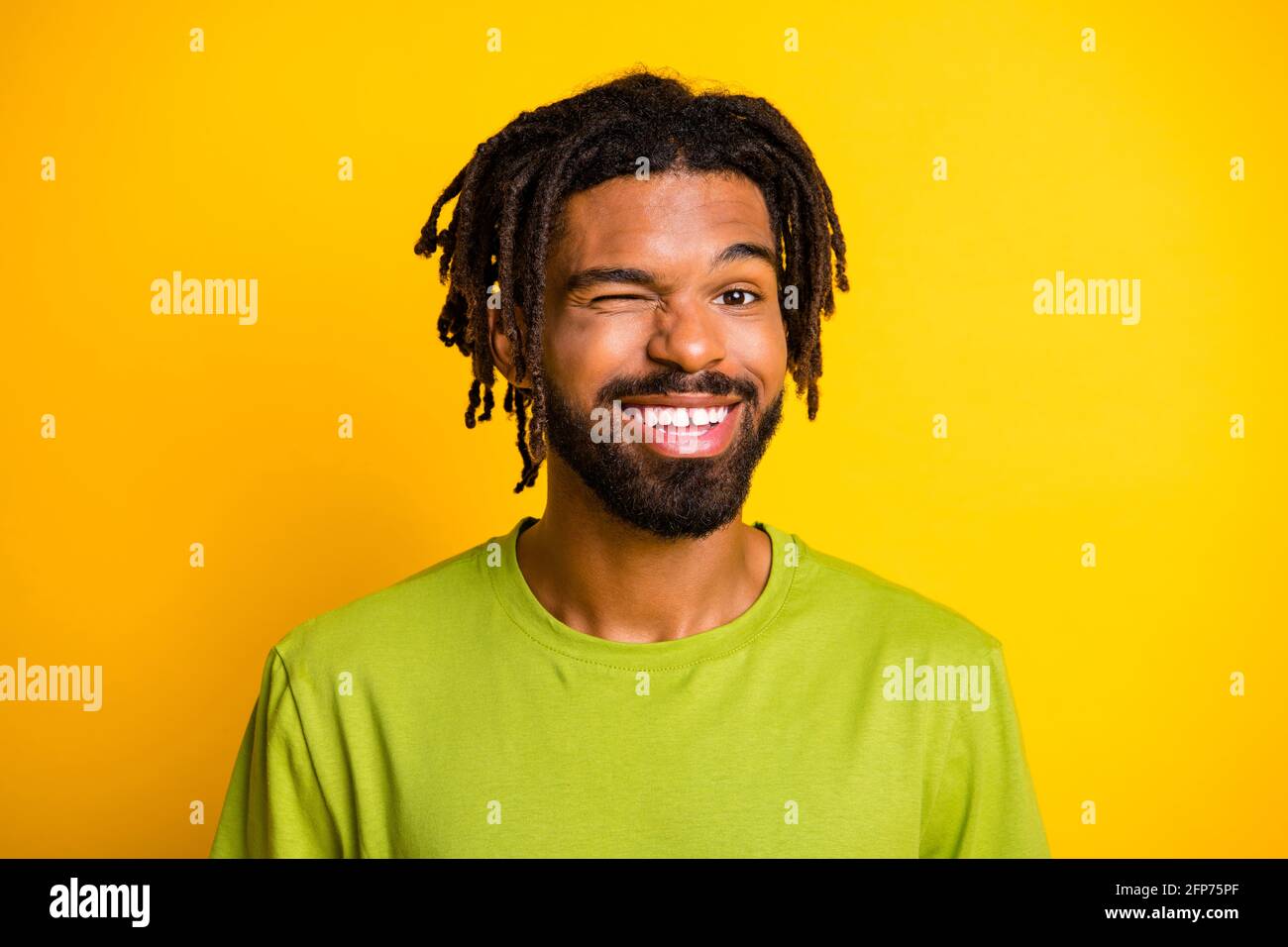 Portrait of nice satisfied dark skin guy wink eye in camera isolated ...