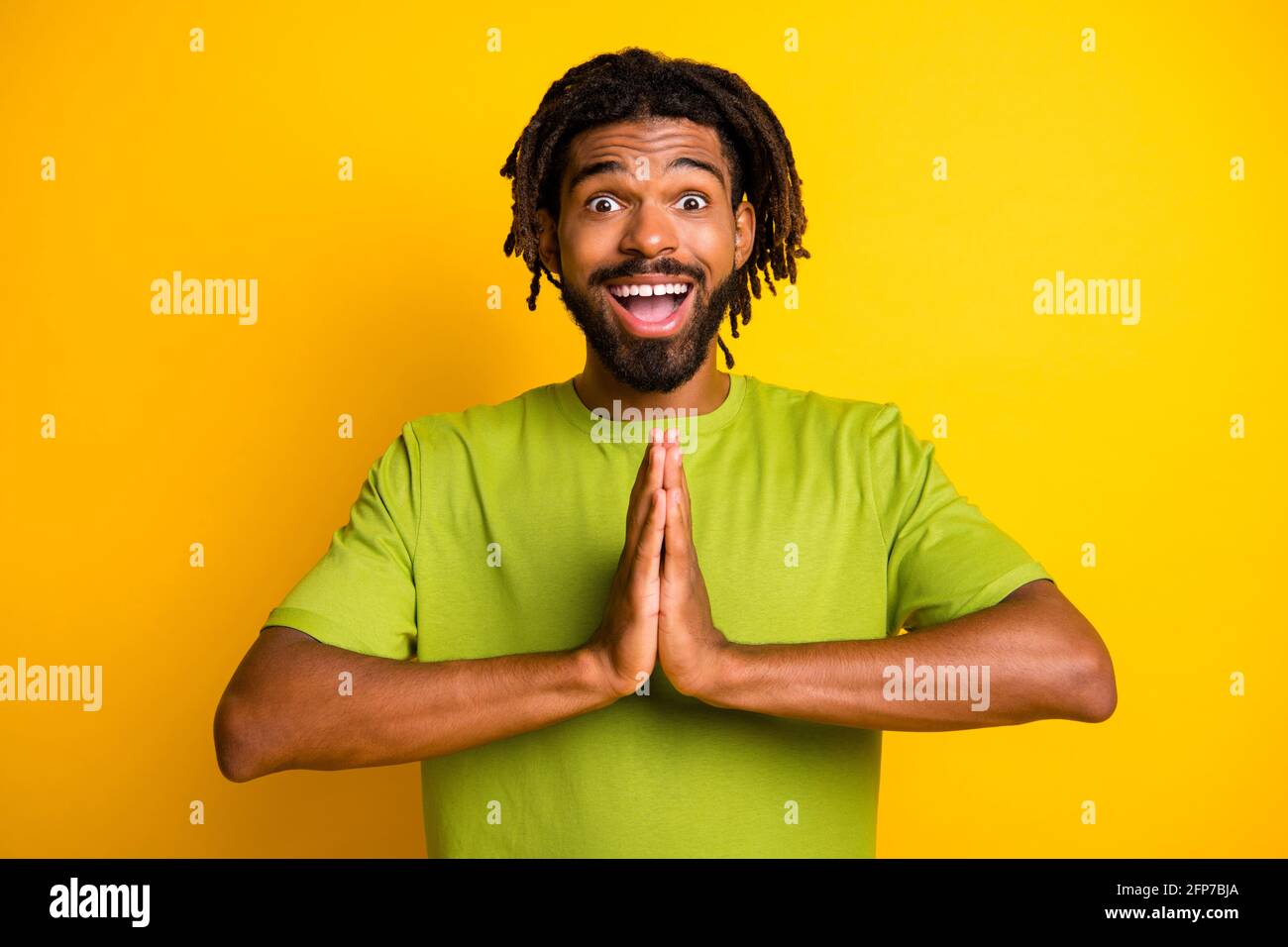 Photo of astonished crazy dark skin guy put hands together scream hope ...
