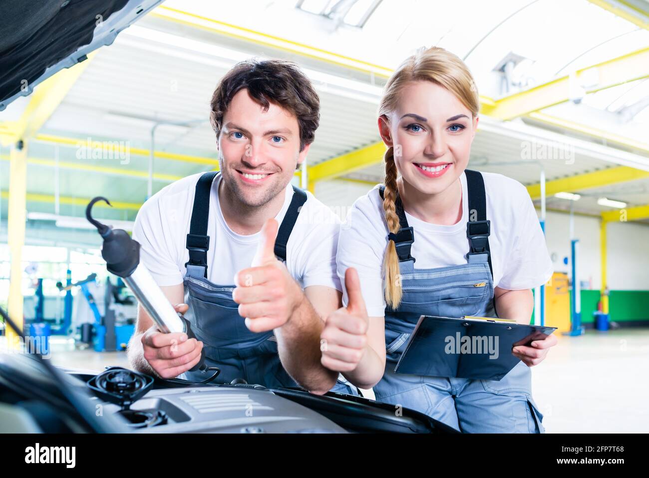 Mechanic team man repair woman hi-res stock photography and images - Alamy