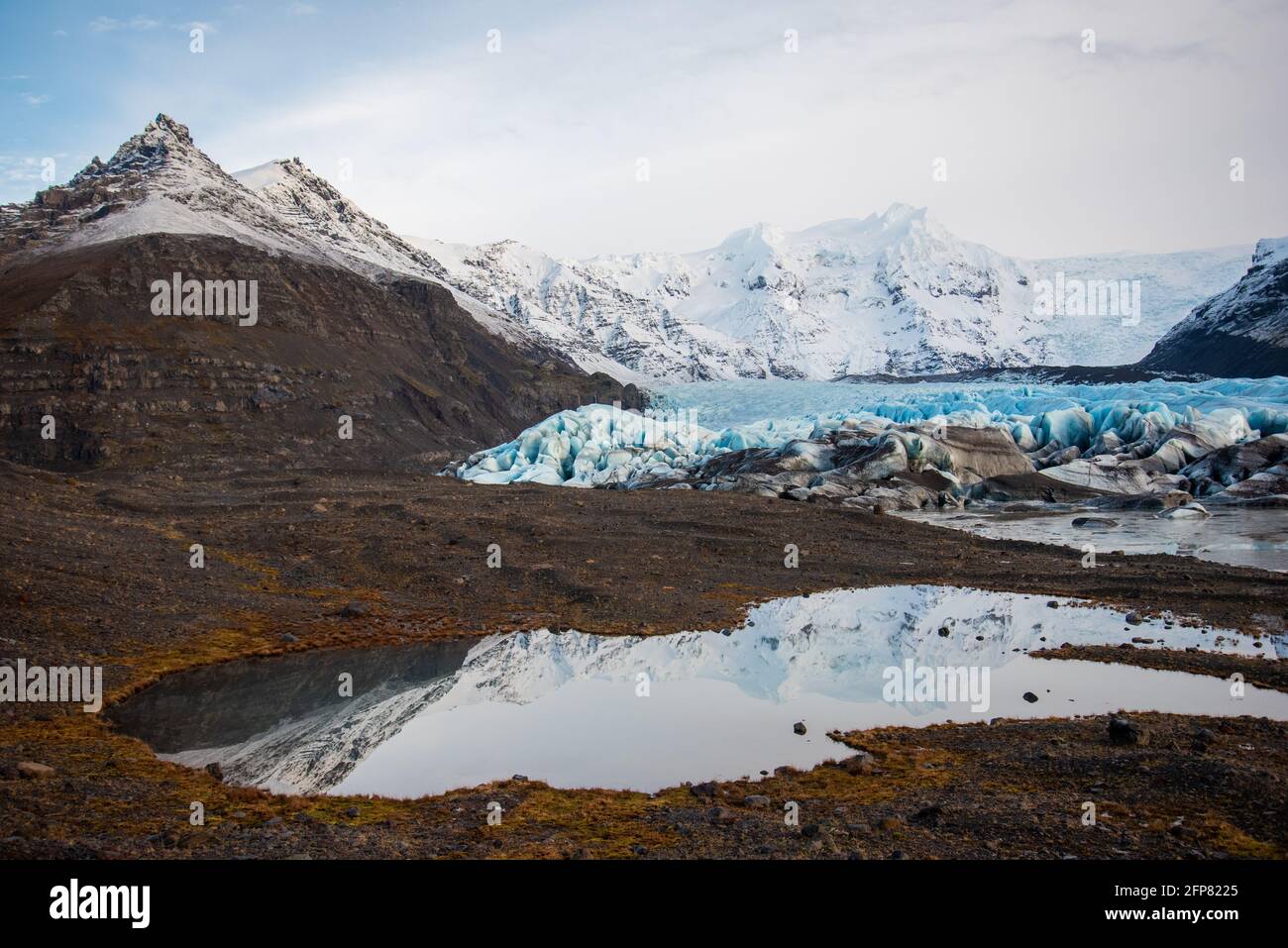 Magical view of Icelandic glacier with layers of iceberg, snow, and ...