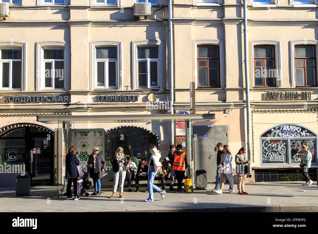 Moscow, Russia - 19 May 2021, Maroseyka street, bus stop. Passengers ...