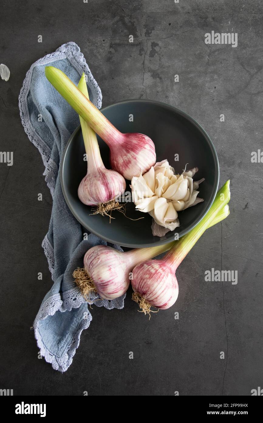 Fresh raw garlic on grey background Stock Photo - Alamy