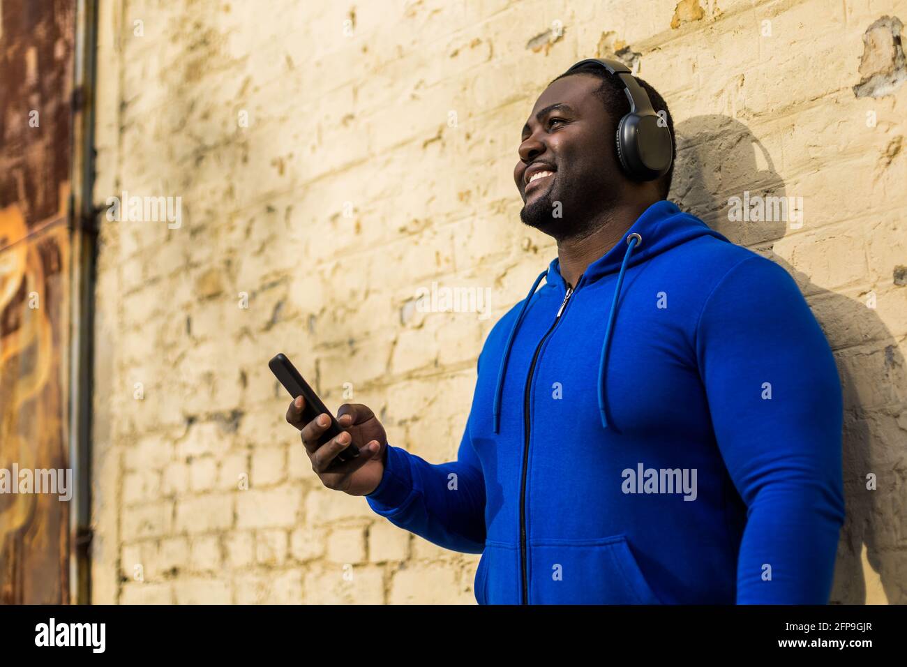Smiling overweight man headphones hi-res stock photography and images ...