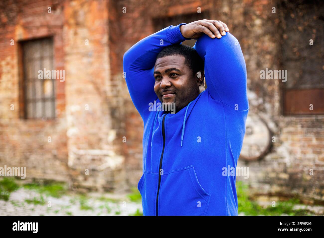 Sporty man enjoys exercising outdoor Stock Photo - Alamy