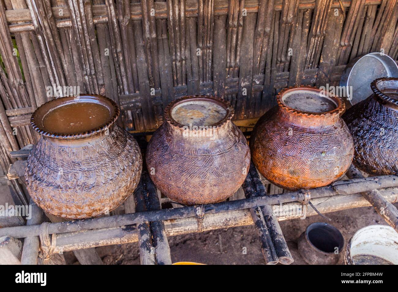 Vessels for a fermentation of a palm wine in Myanmar Stock Photo - Alamy