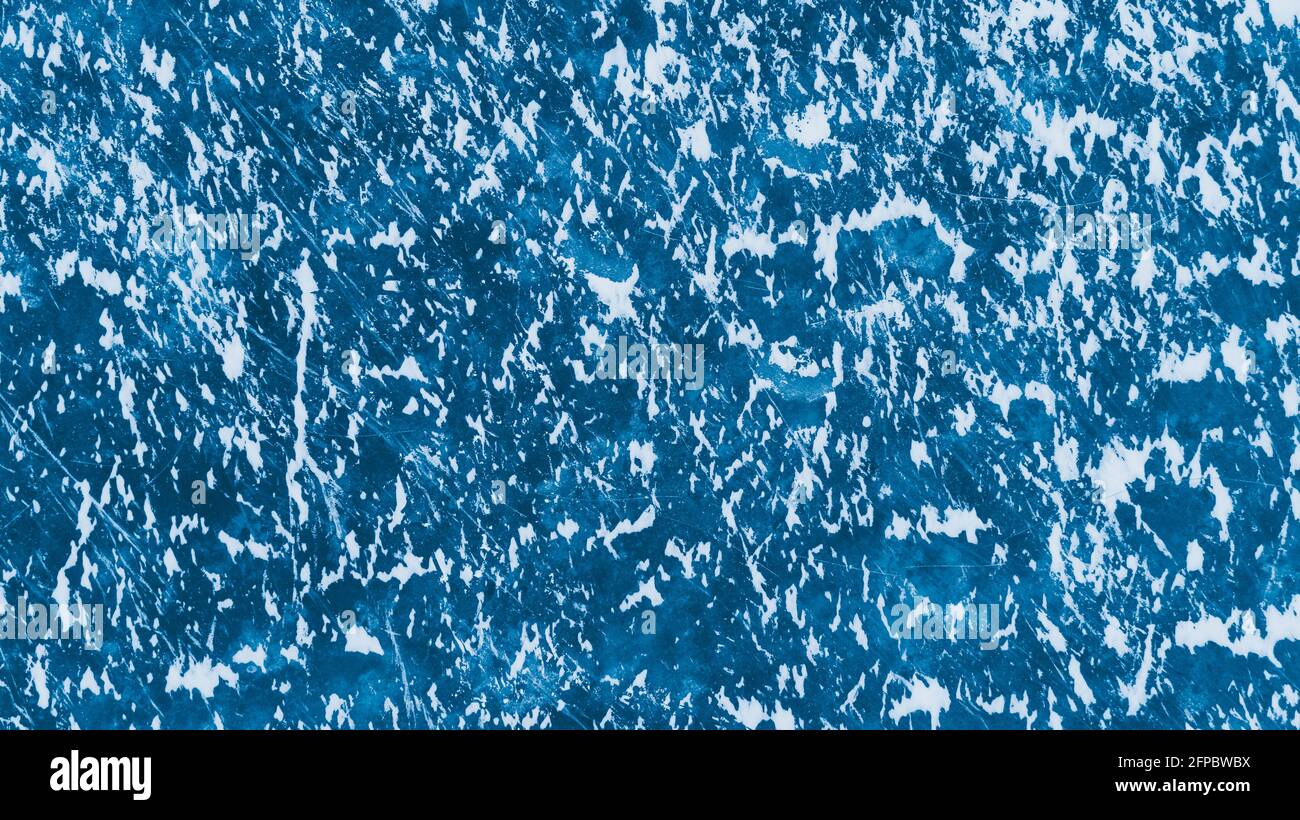 Blue ice surface with scratches and snow Stock Photo - Alamy