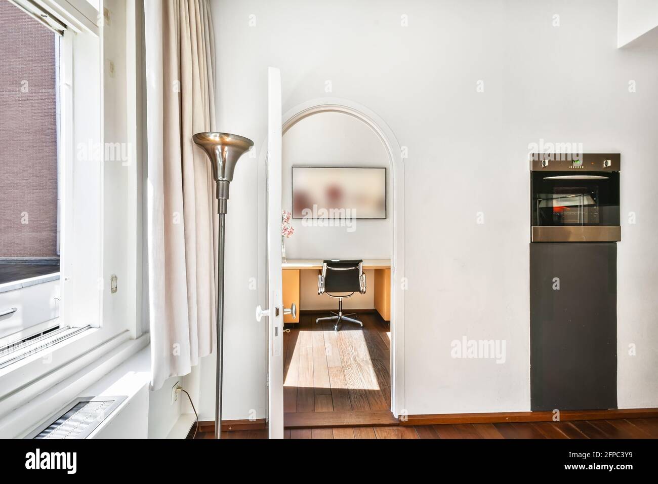 Detail of home interior design with open arched door connecting light ...