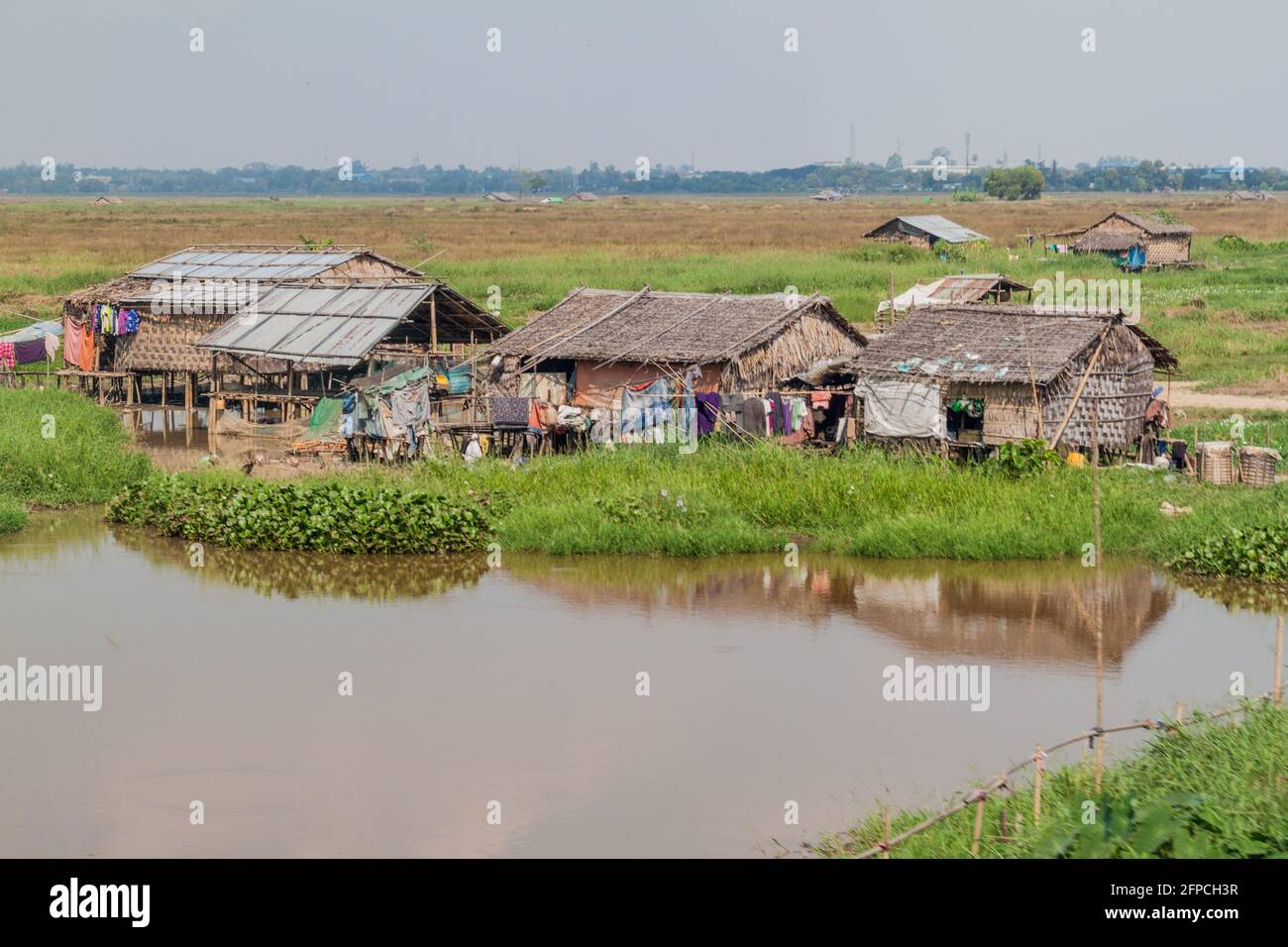 Fields and houses in a suburbs of Yangon, Myanmar Stock Photo - Alamy